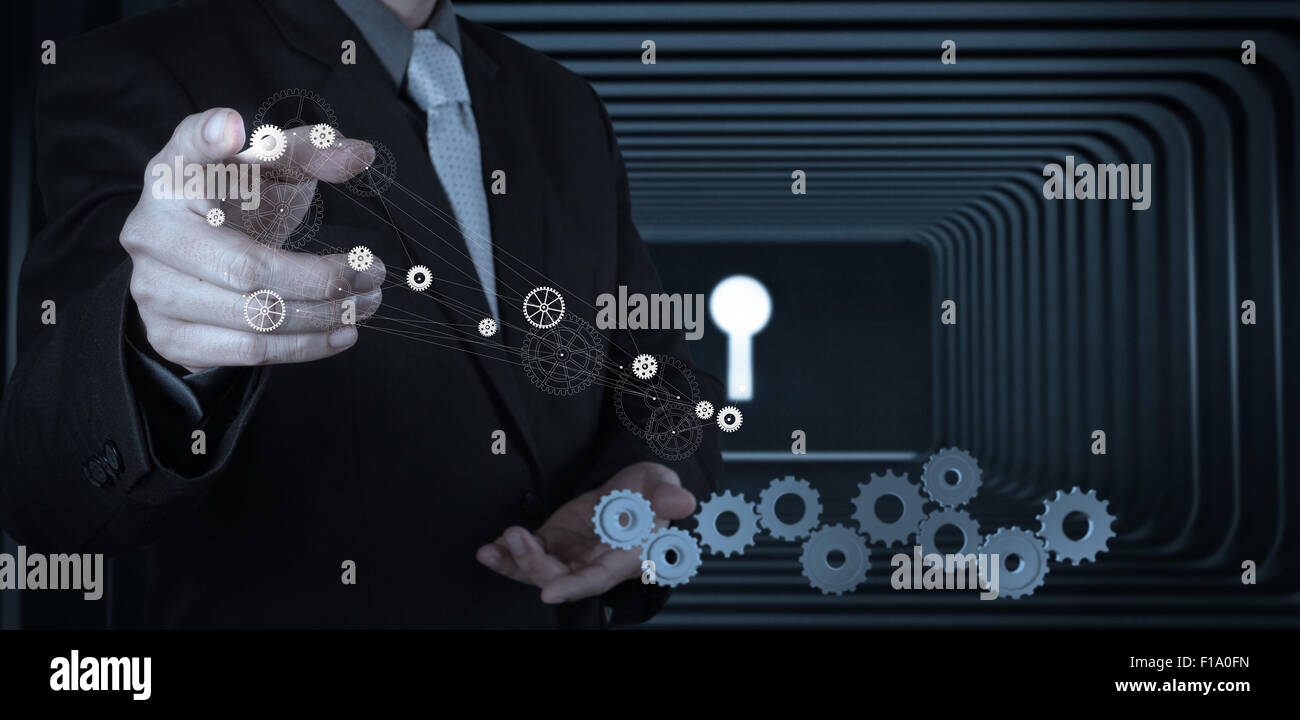 Businessman hand with key to success as concept Stock Photo - Alamy