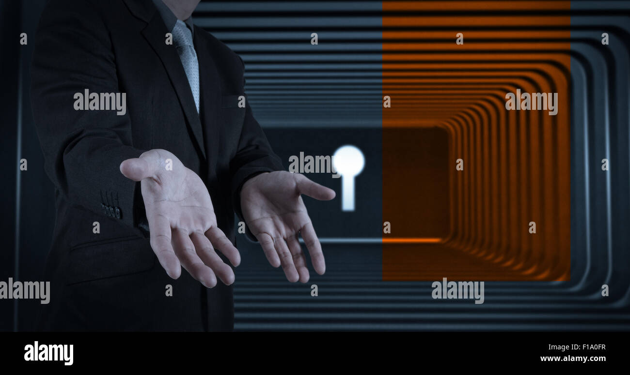 businessman open hands to a gate shaped like a keyhole as concept and ...