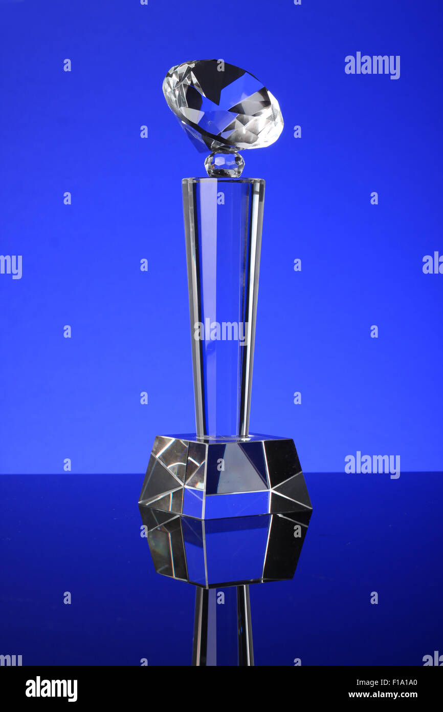 glass trophy in blue background Stock Photo - Alamy