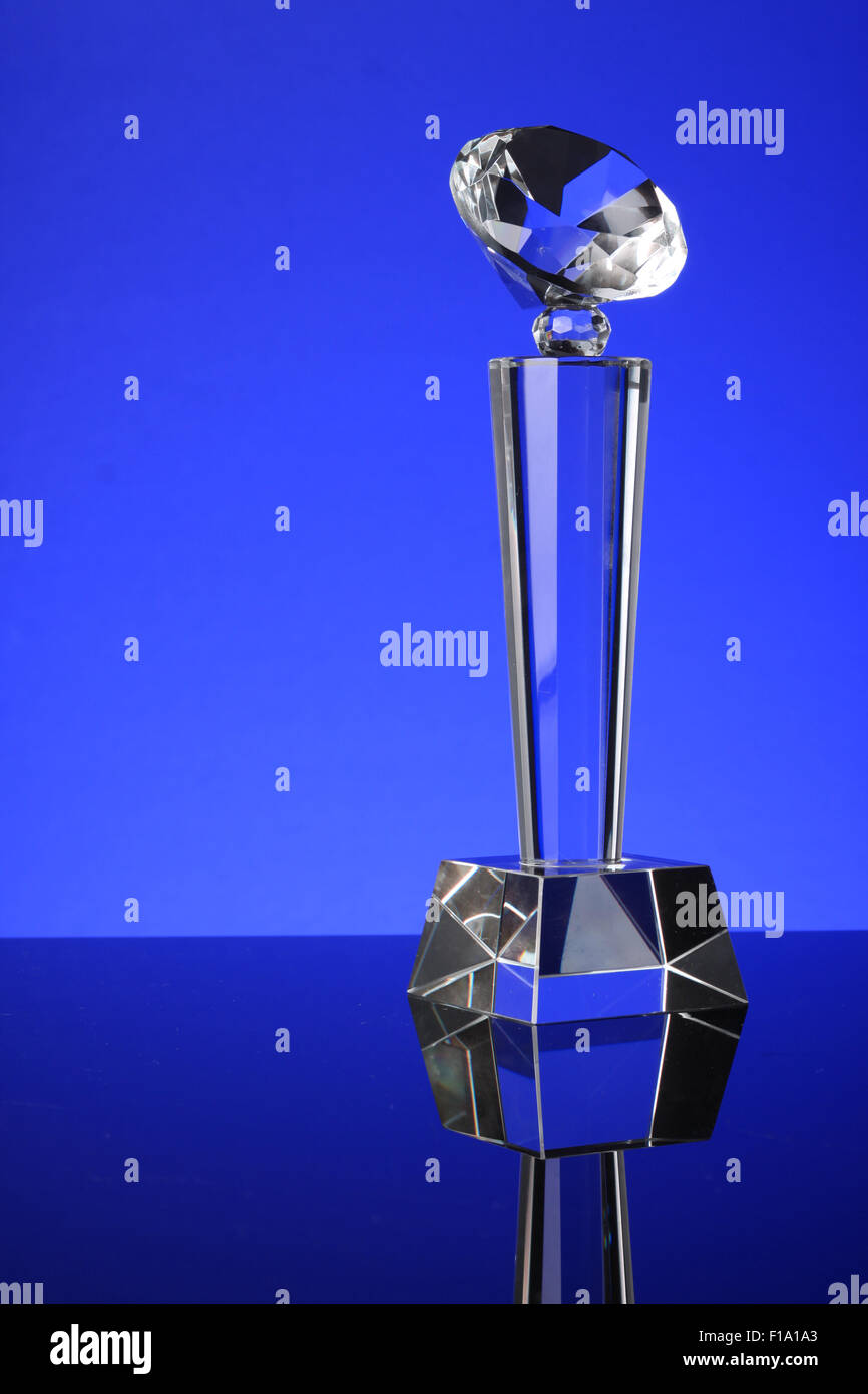 glass trophy in blue background Stock Photo - Alamy