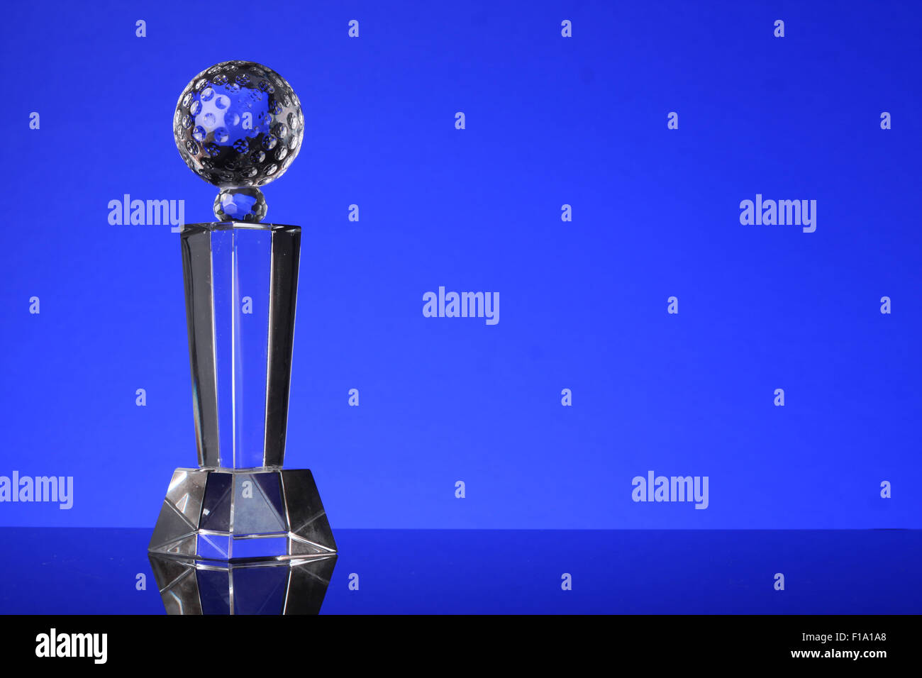 glass trophy in blue background Stock Photo - Alamy