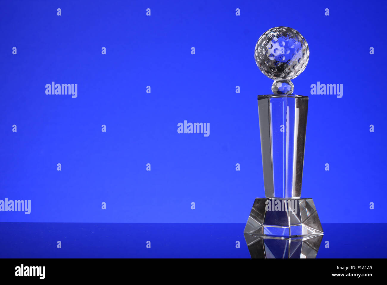 glass trophy in blue background Stock Photo - Alamy