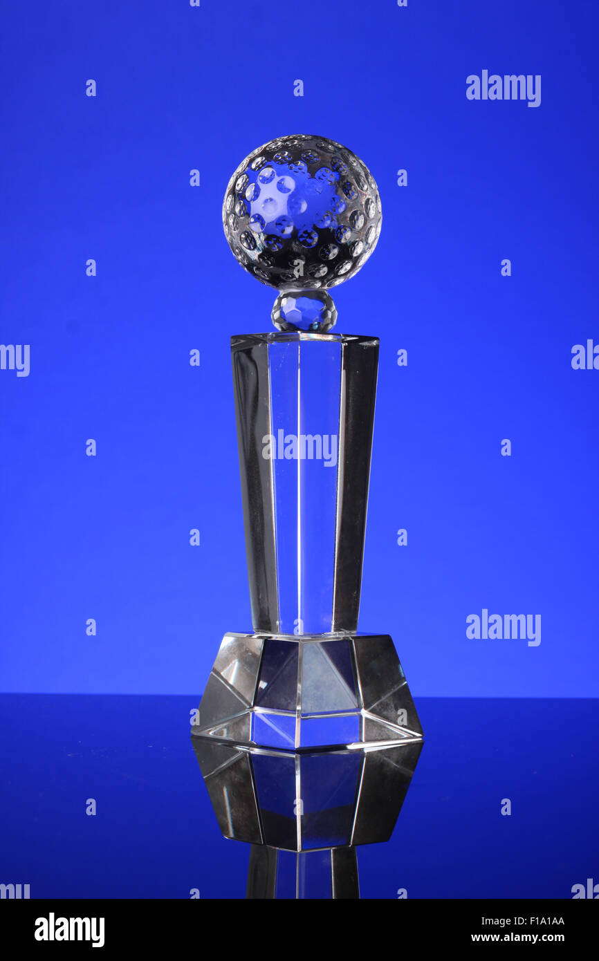 glass trophy in blue background Stock Photo - Alamy