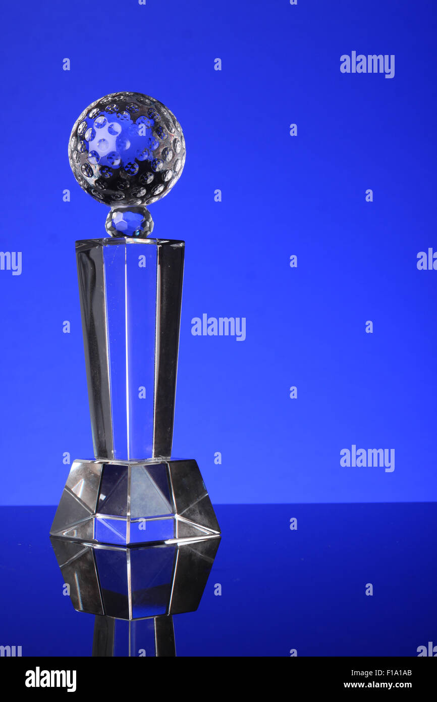glass trophy in blue background Stock Photo - Alamy