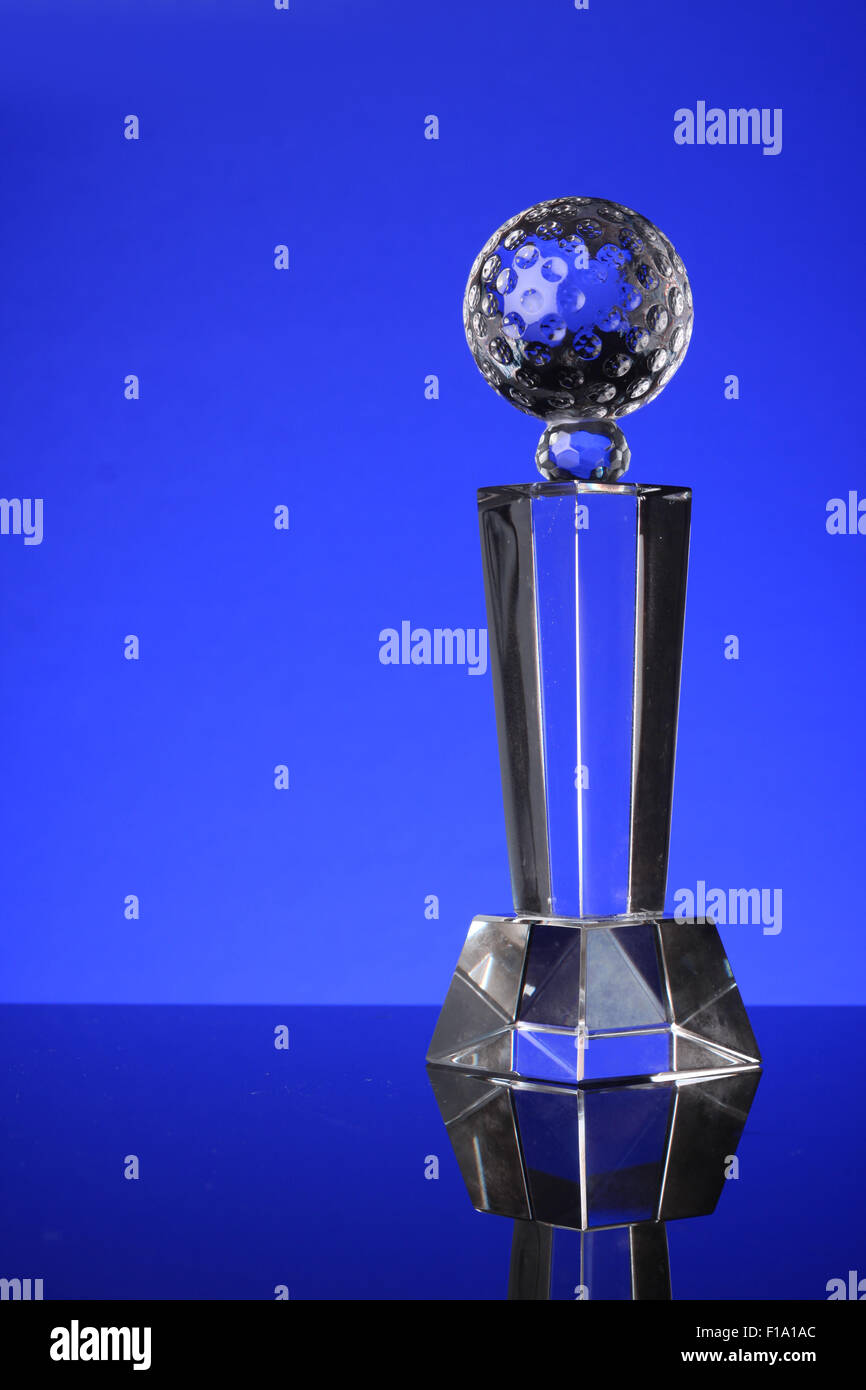 glass trophy in blue background Stock Photo - Alamy