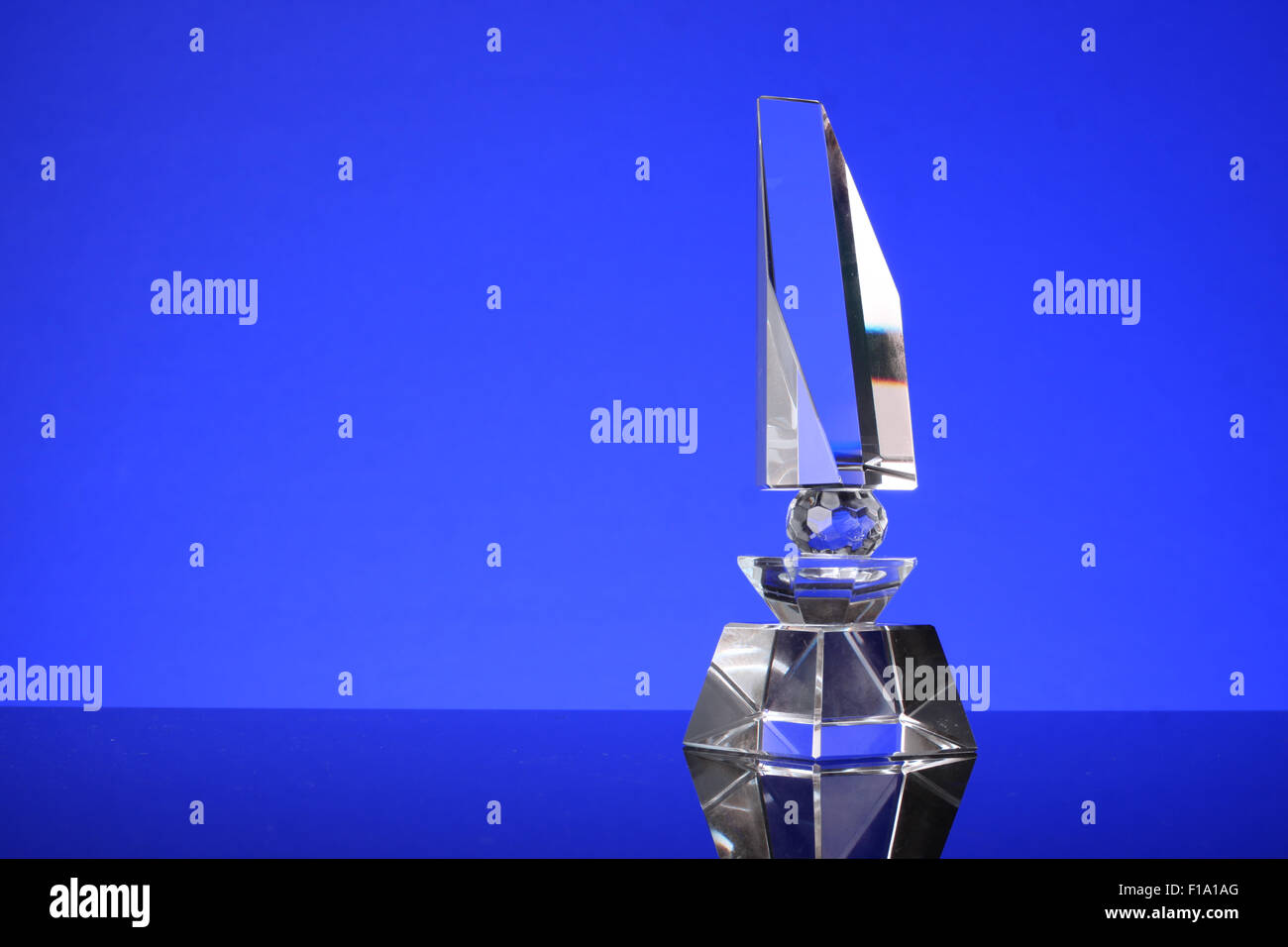 glass trophy in blue background Stock Photo - Alamy