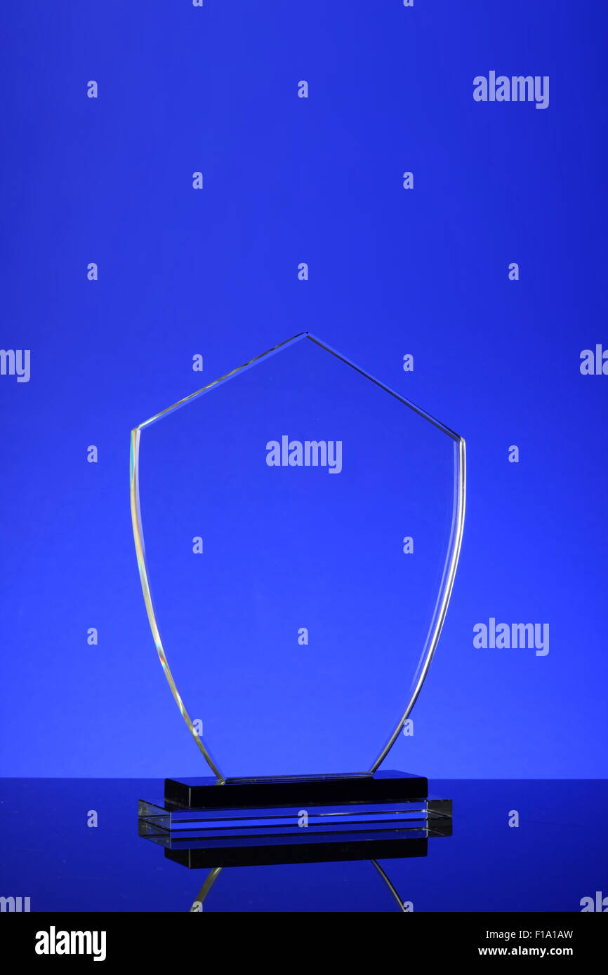 glass trophy in blue background Stock Photo - Alamy