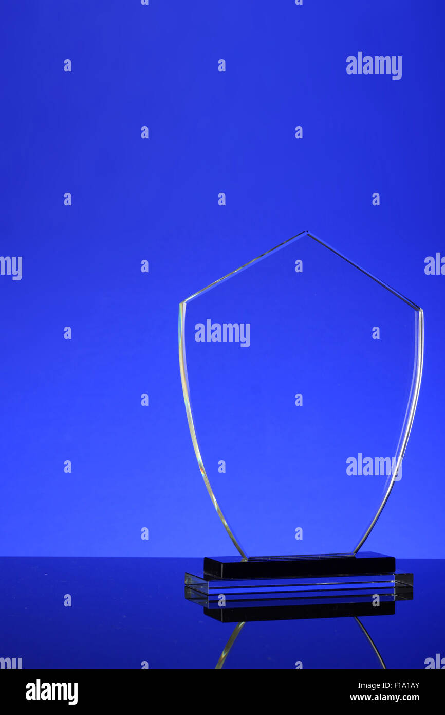 glass trophy in blue background Stock Photo - Alamy