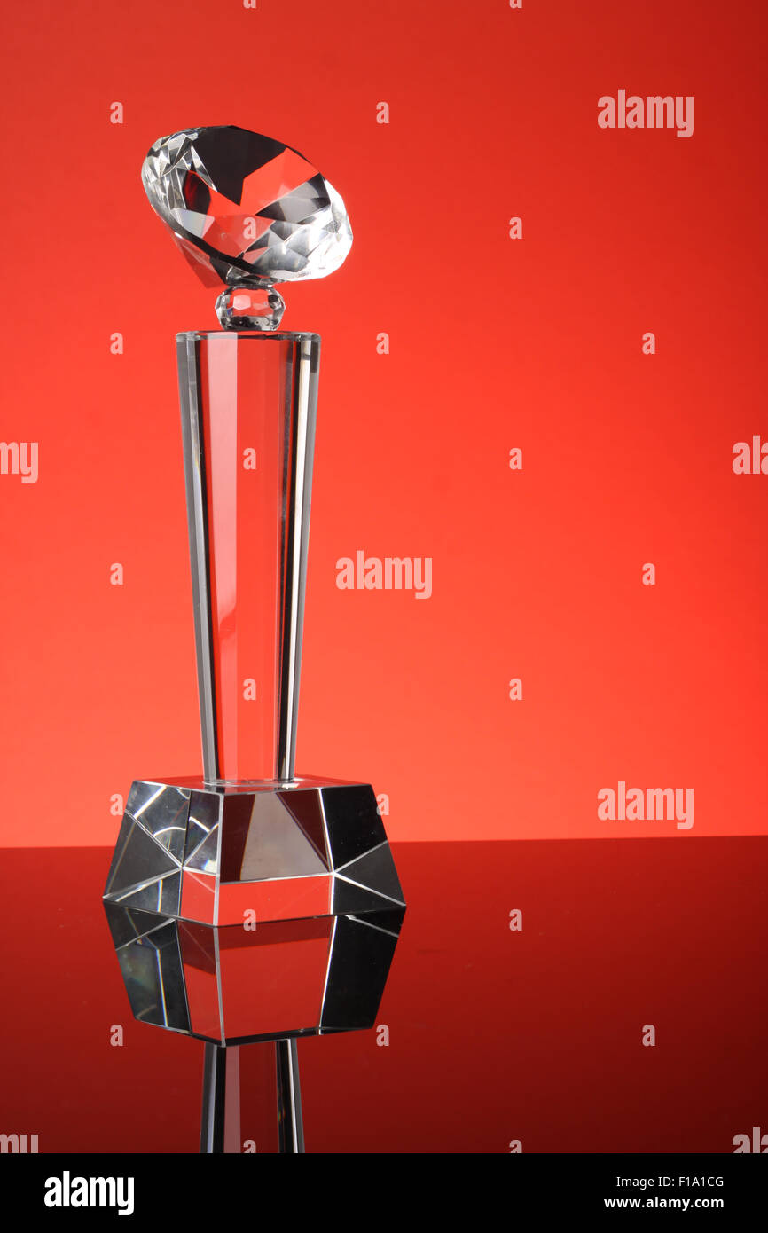 glass trophy in red background Stock Photo - Alamy