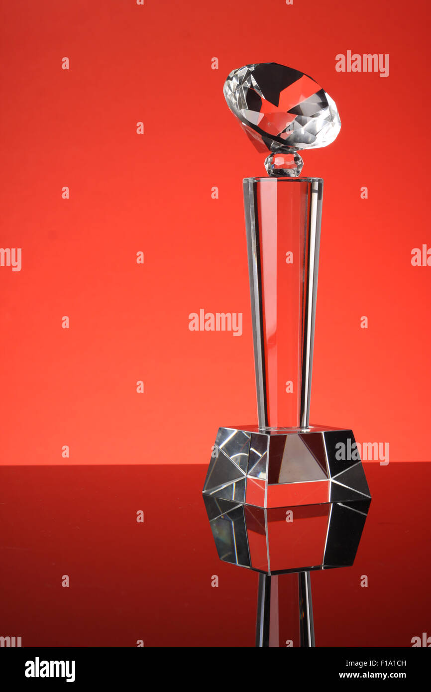glass trophy in red background Stock Photo - Alamy