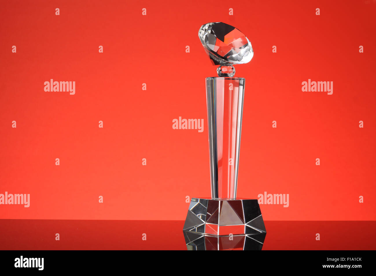 glass trophy in red background Stock Photo - Alamy