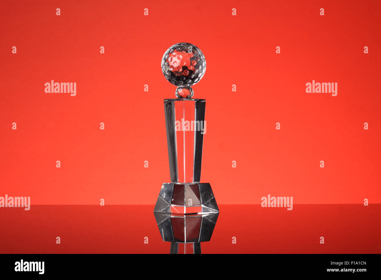 glass trophy in red background Stock Photo - Alamy