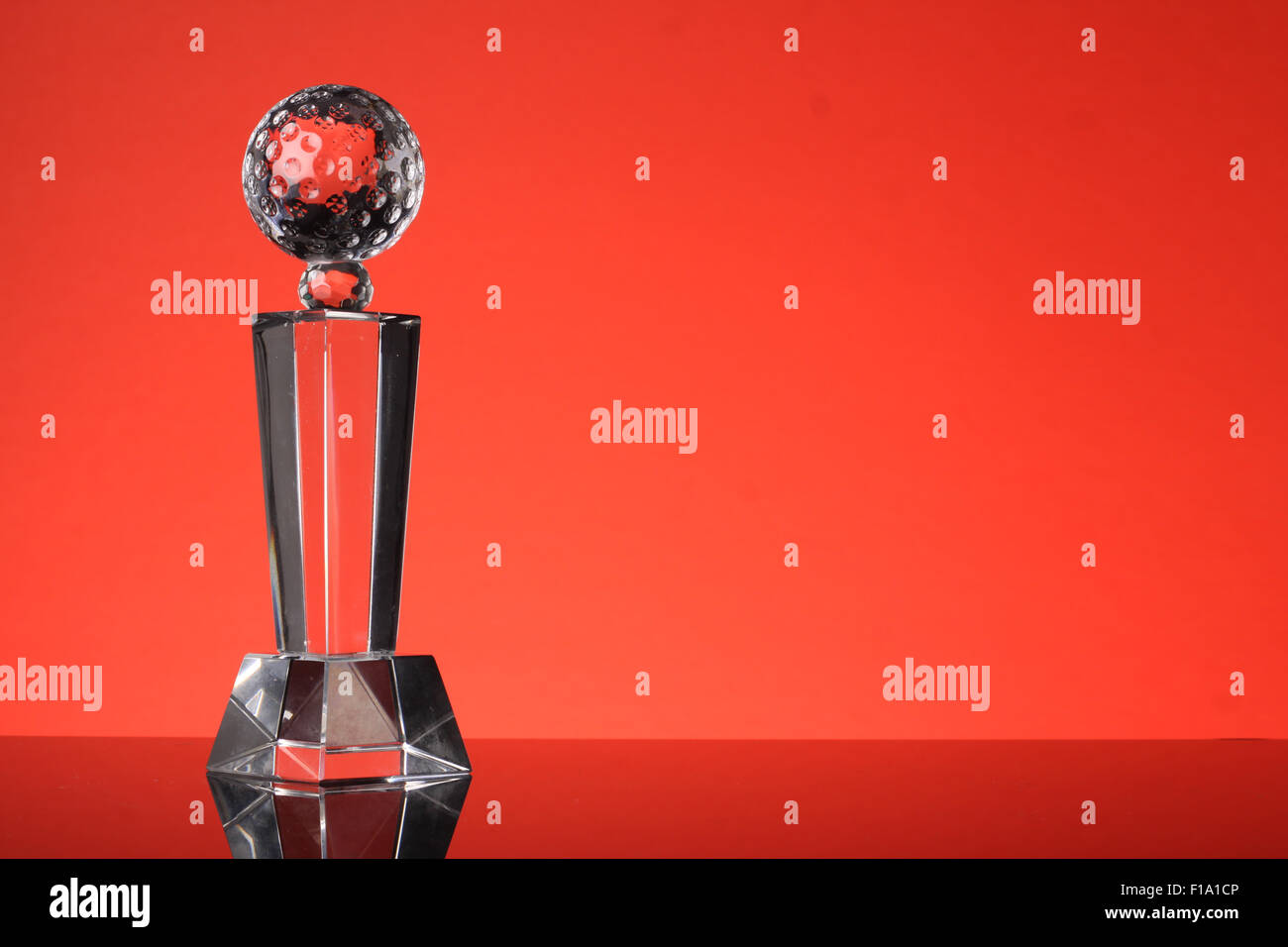 glass trophy in red background Stock Photo - Alamy