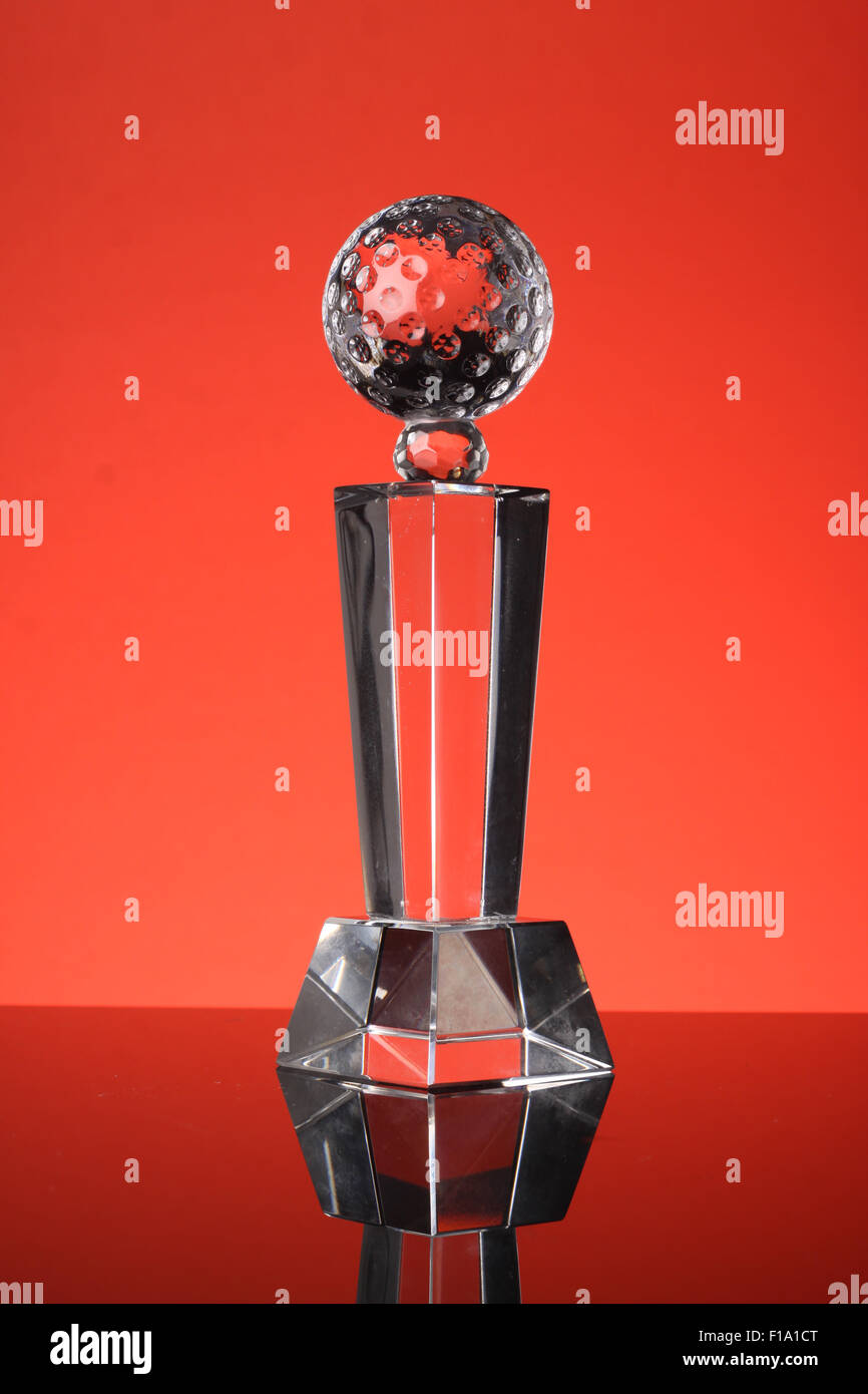 glass trophy in red background Stock Photo - Alamy