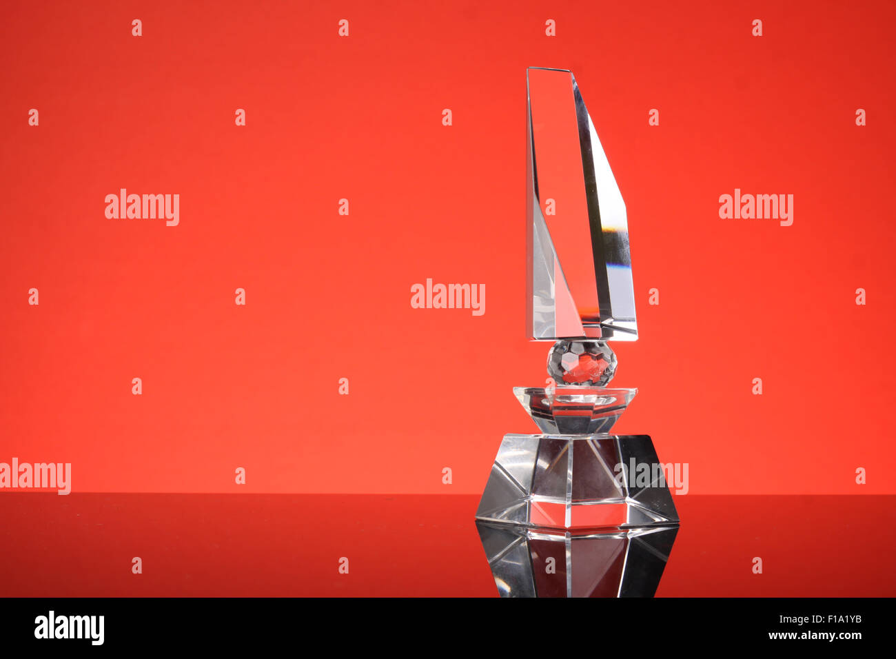 glass trophy in red background Stock Photo - Alamy