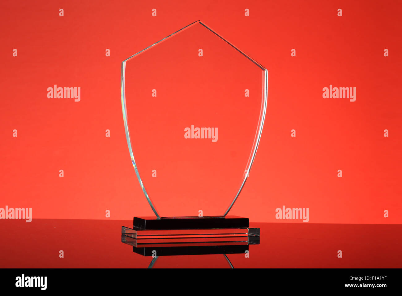 glass trophy in red background Stock Photo - Alamy
