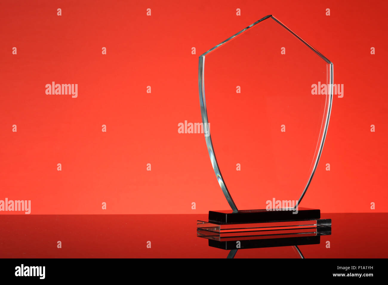 glass trophy in red background Stock Photo - Alamy