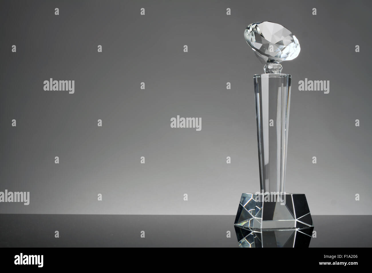 glass trophy in gray background Stock Photo - Alamy