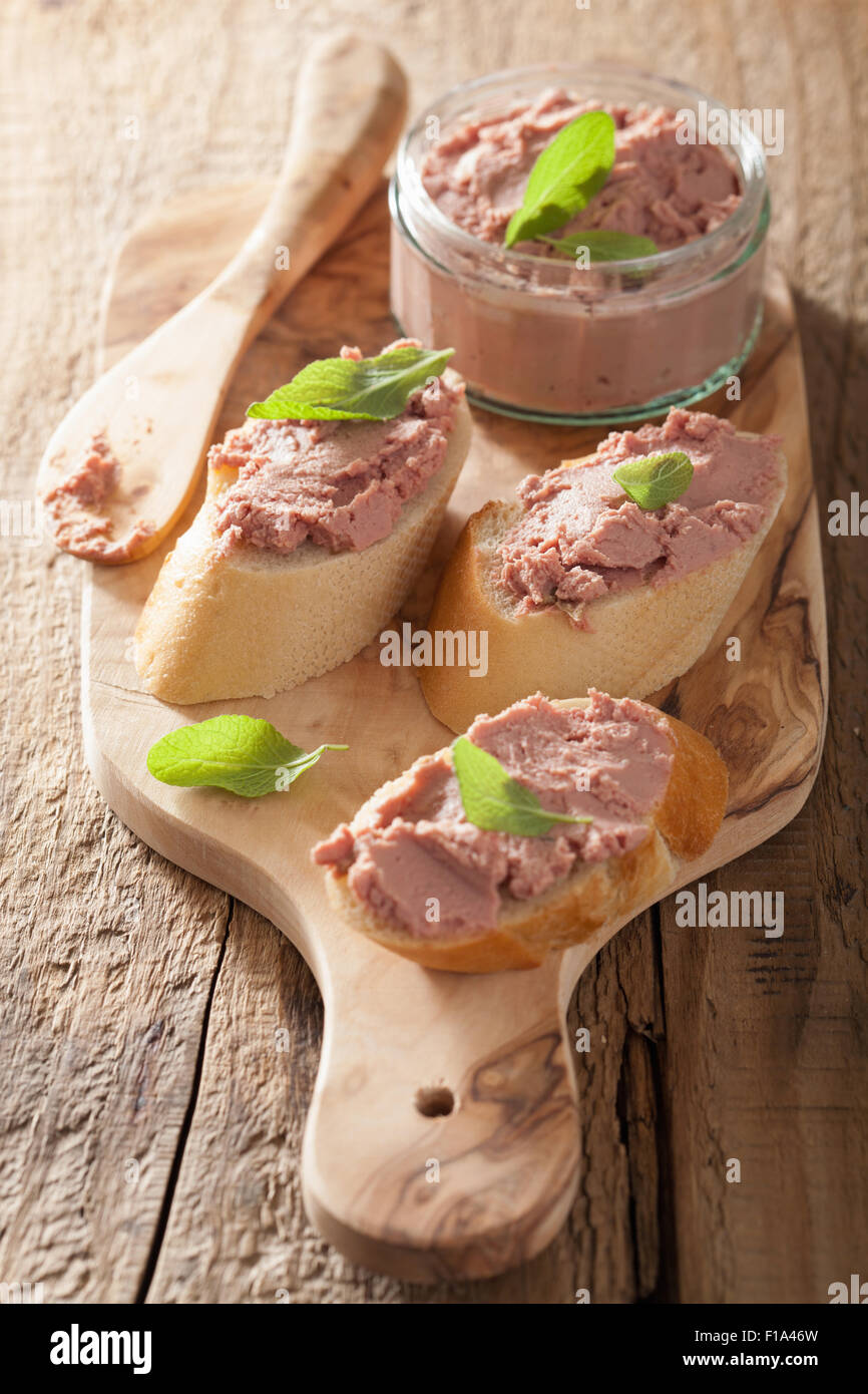 healthy chicken liver pate with sage in jar and on bread Stock Photo ...