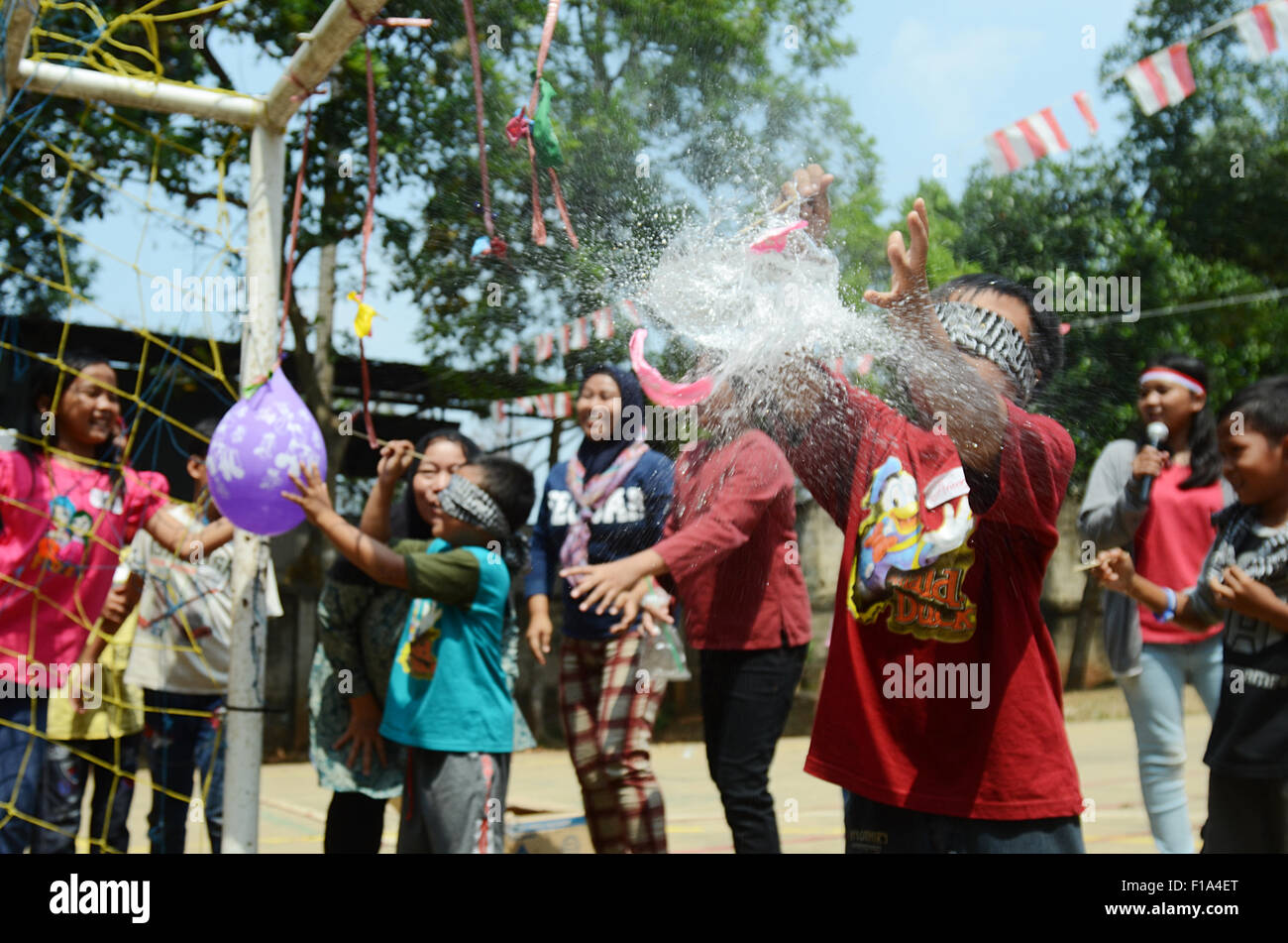 kids splash baloon with water in game, at Indonesia aniversary ...