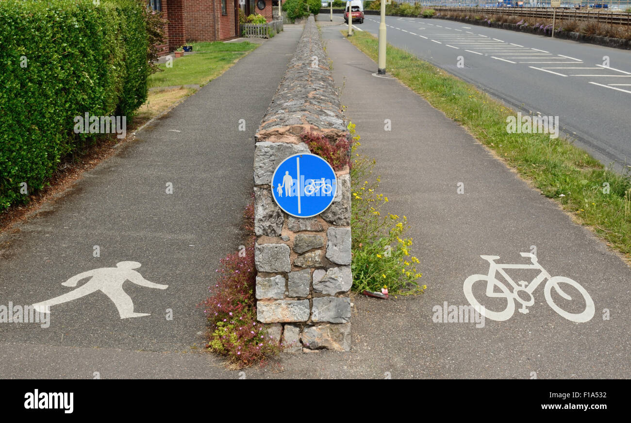 Signs on the pavement separating pedestrians and cyclists Stock Photo ...