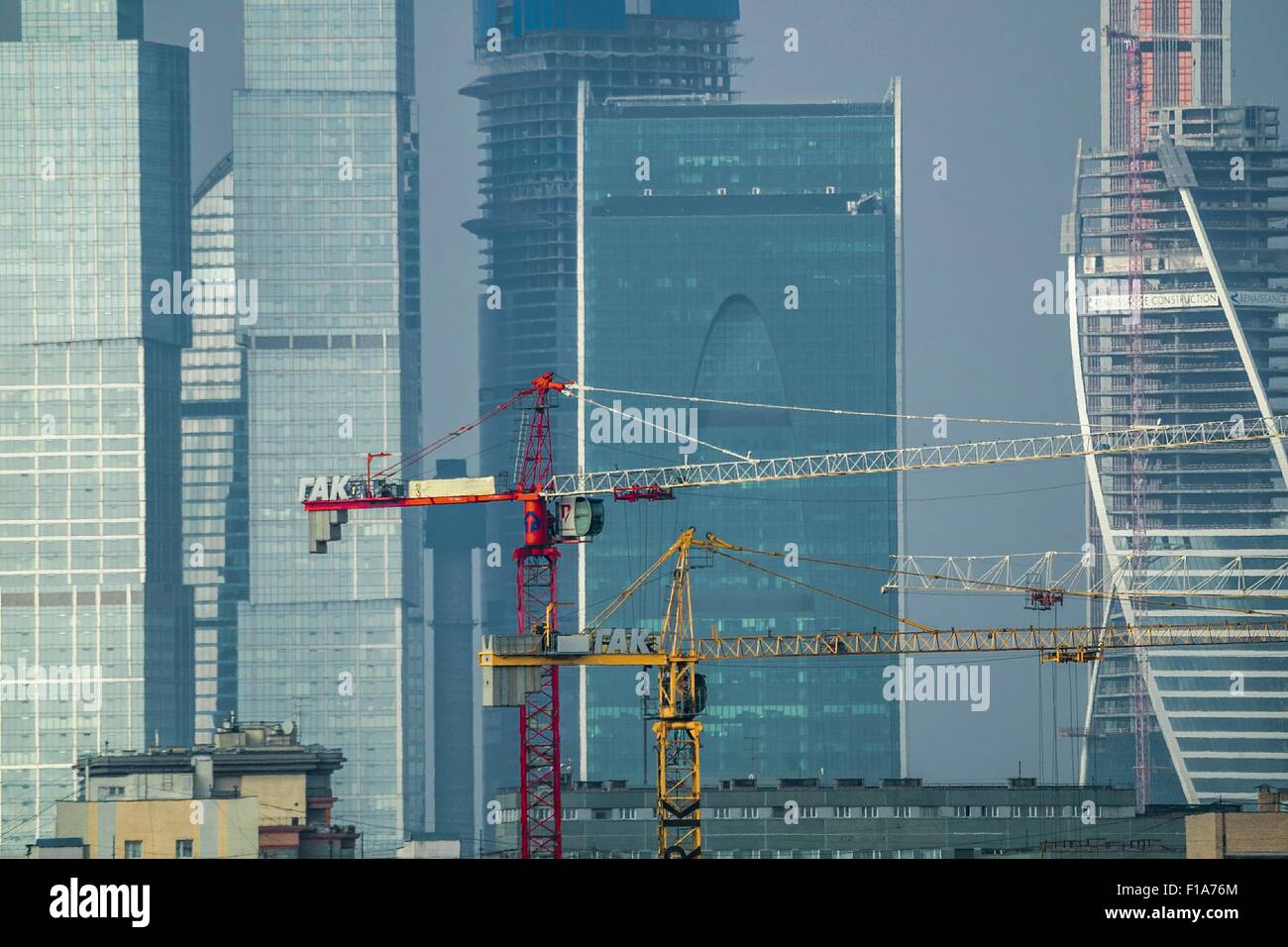 Moscow, Russia. Construction cranes on the background of skyscrapers ...