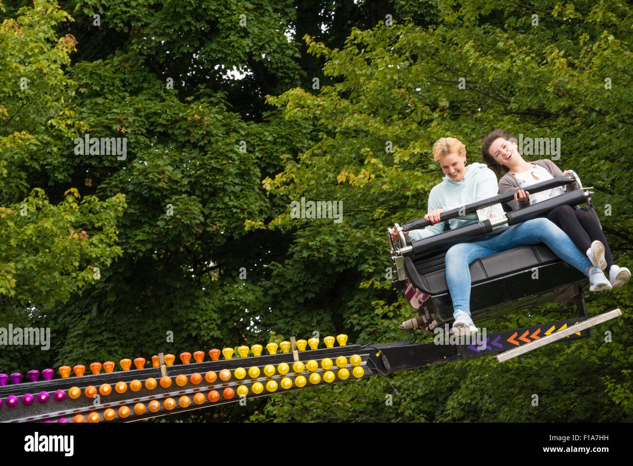 Two girls on a fast ride at the fun fair in the West Park Wolverhampton ...