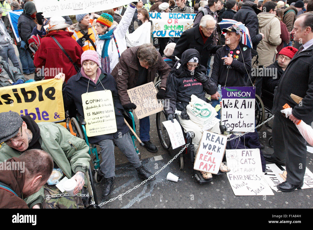 Members of Disabled People Against Cuts and UK Uncut demonstrate ...