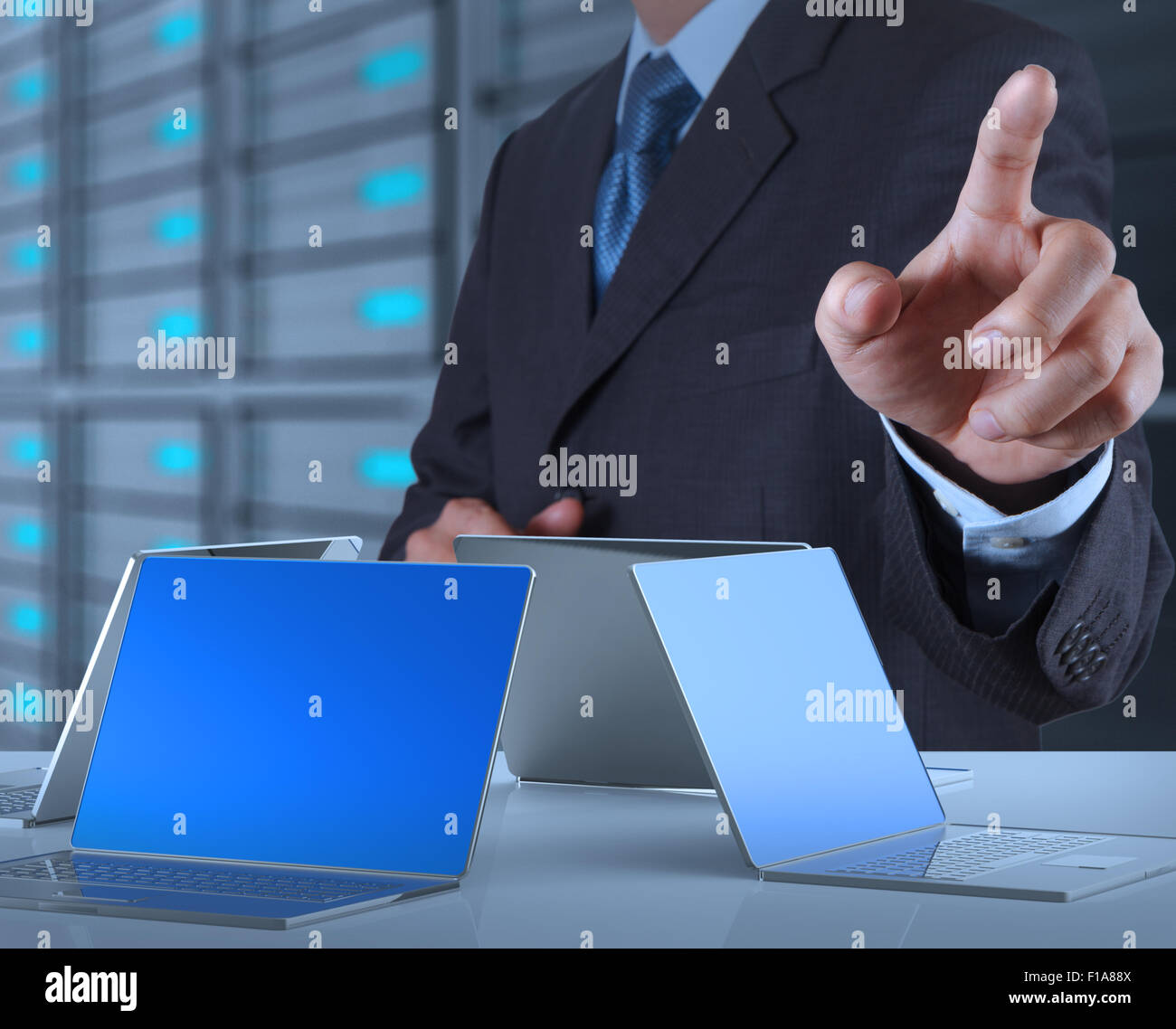 businessman hand pressing a touchscreen button on server background ...