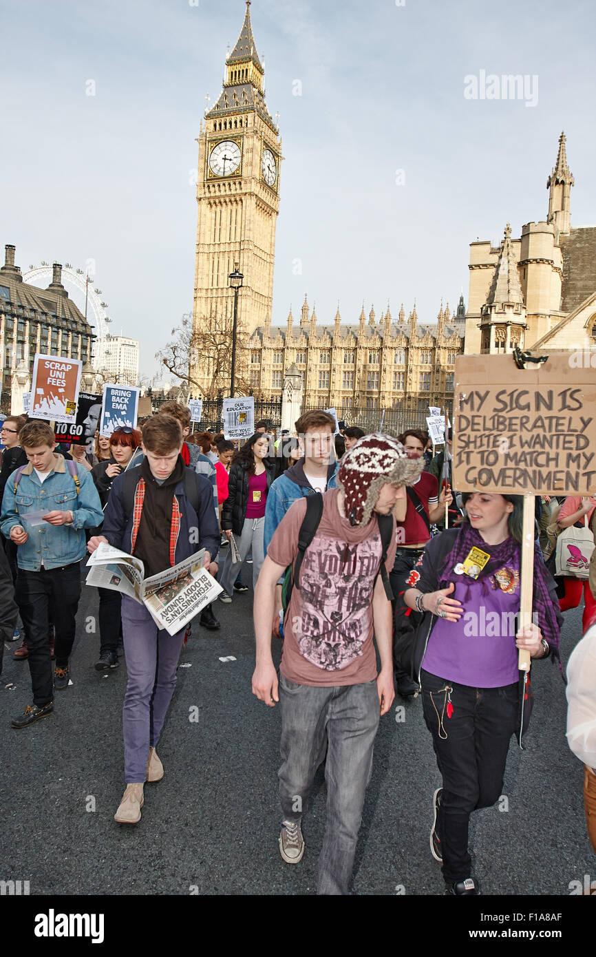Protesters march past parliament to protest against rising tuition fees ...
