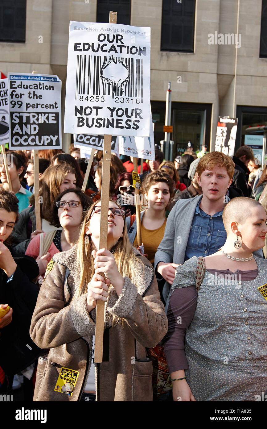Protesters march past parliament to protest against rising tuition fees ...