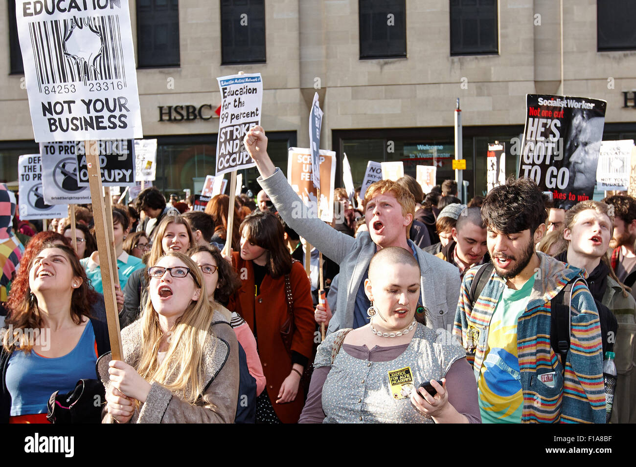 Protesters march past parliament to protest against rising tuition fees ...