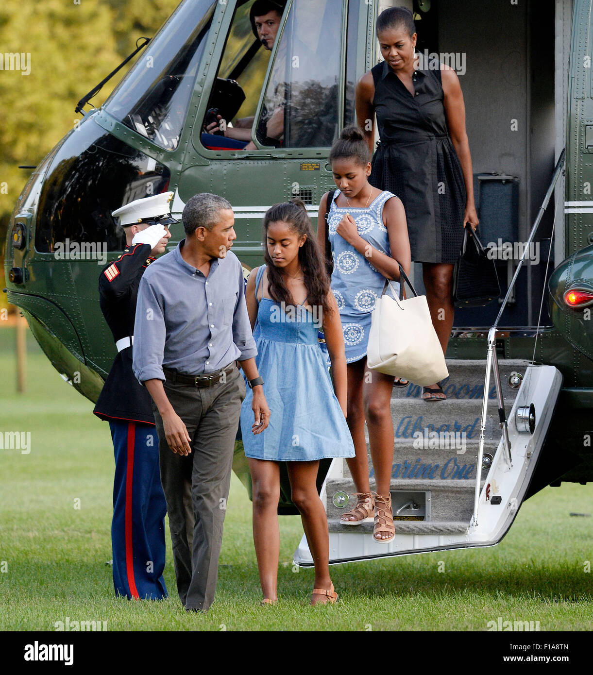 United States President Barack Obama (L), daughters Sasha (3nd L ...