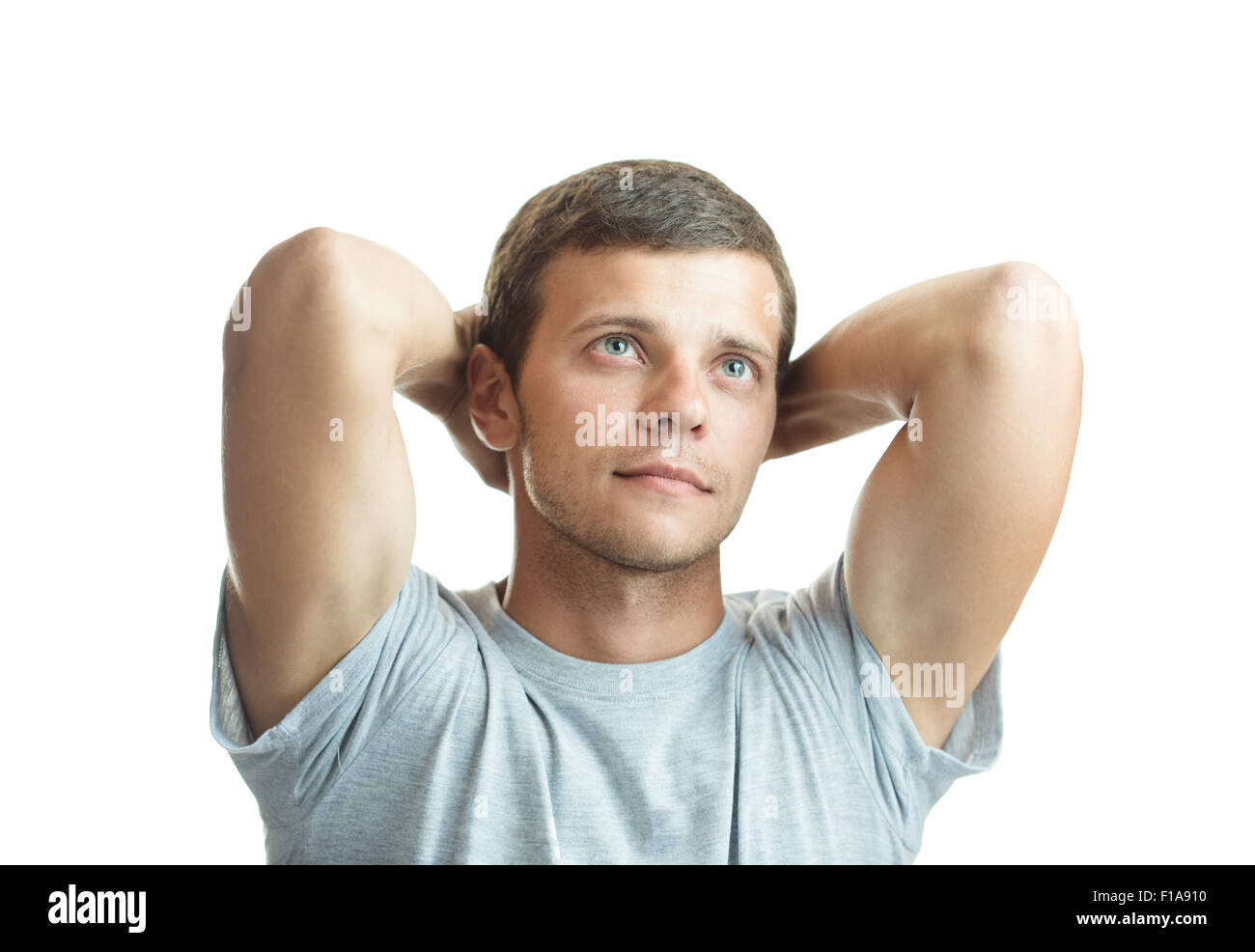 Portrait of smiling happy young man looking up - isolated on white ...