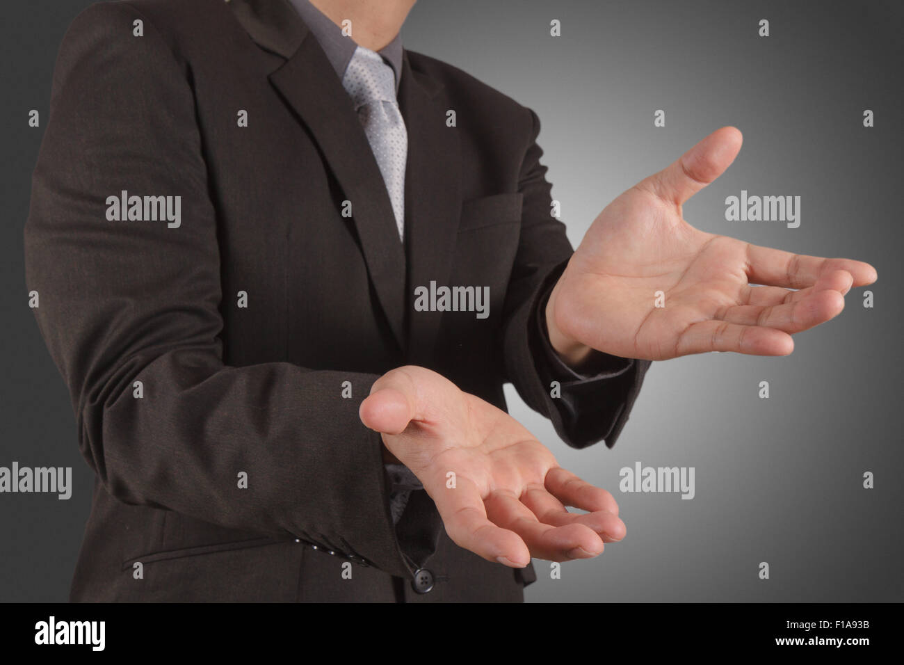business man with an open hand as showing something concept Stock Photo ...