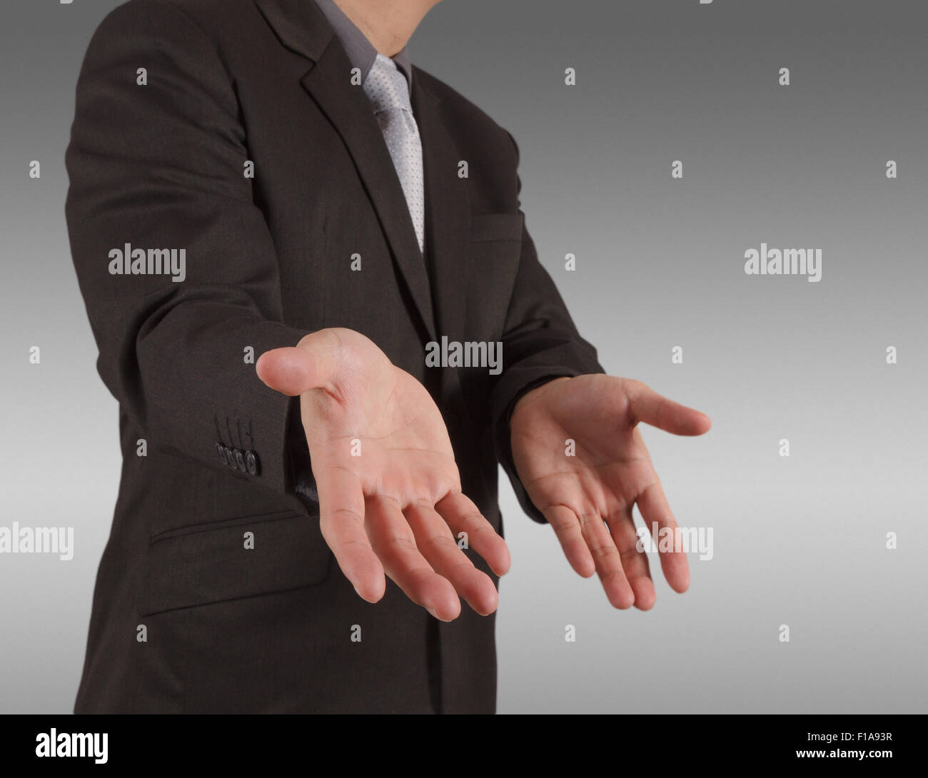 business man with an open hand as showing something concept Stock Photo ...