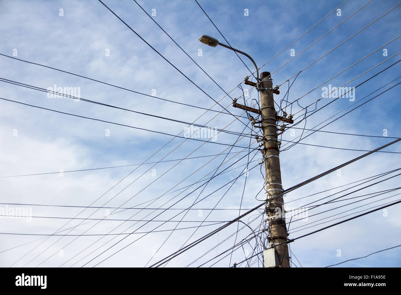 Lamp post with many cables that run in different directions Stock Photo ...