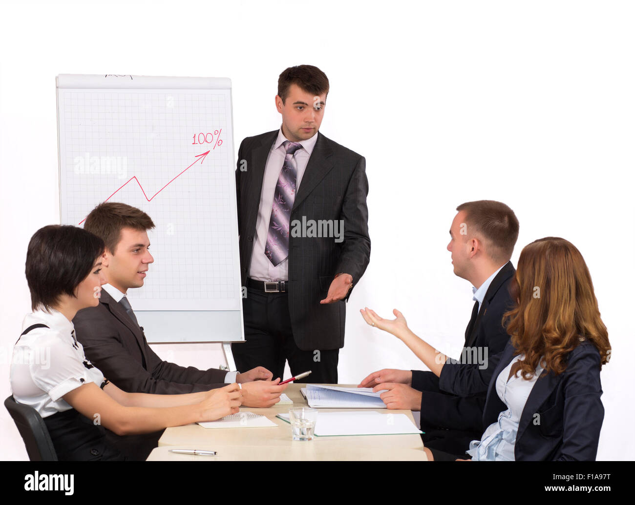 Young male manager leading the brainstorming discussion with his ...