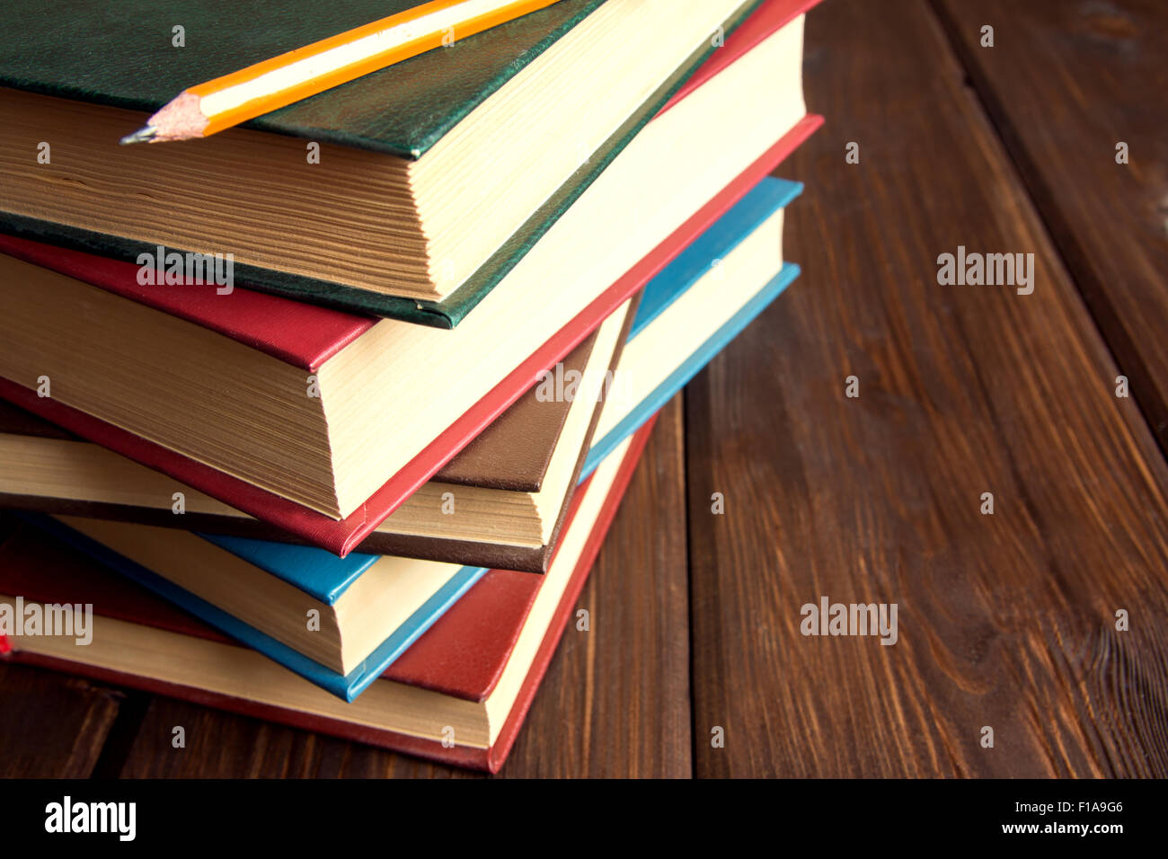 Stack of old books over rustic wooden background with copy space Stock ...