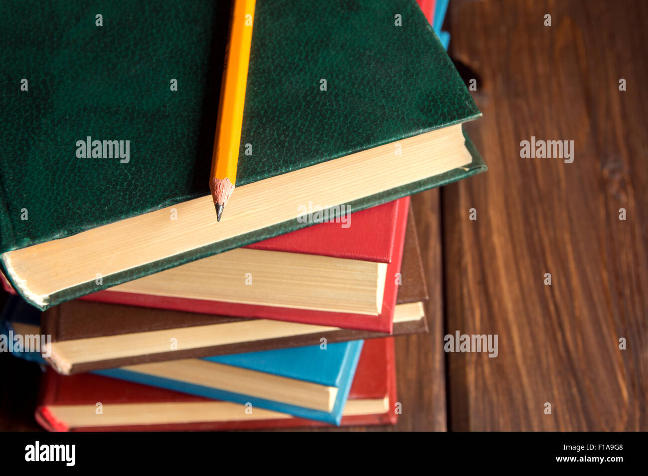 Stack of old books over rustic wooden background with copy space Stock ...