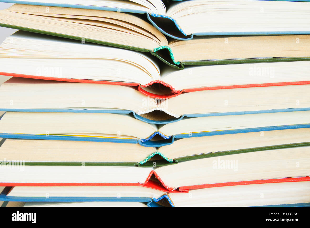 Stack of open books close up Stock Photo - Alamy