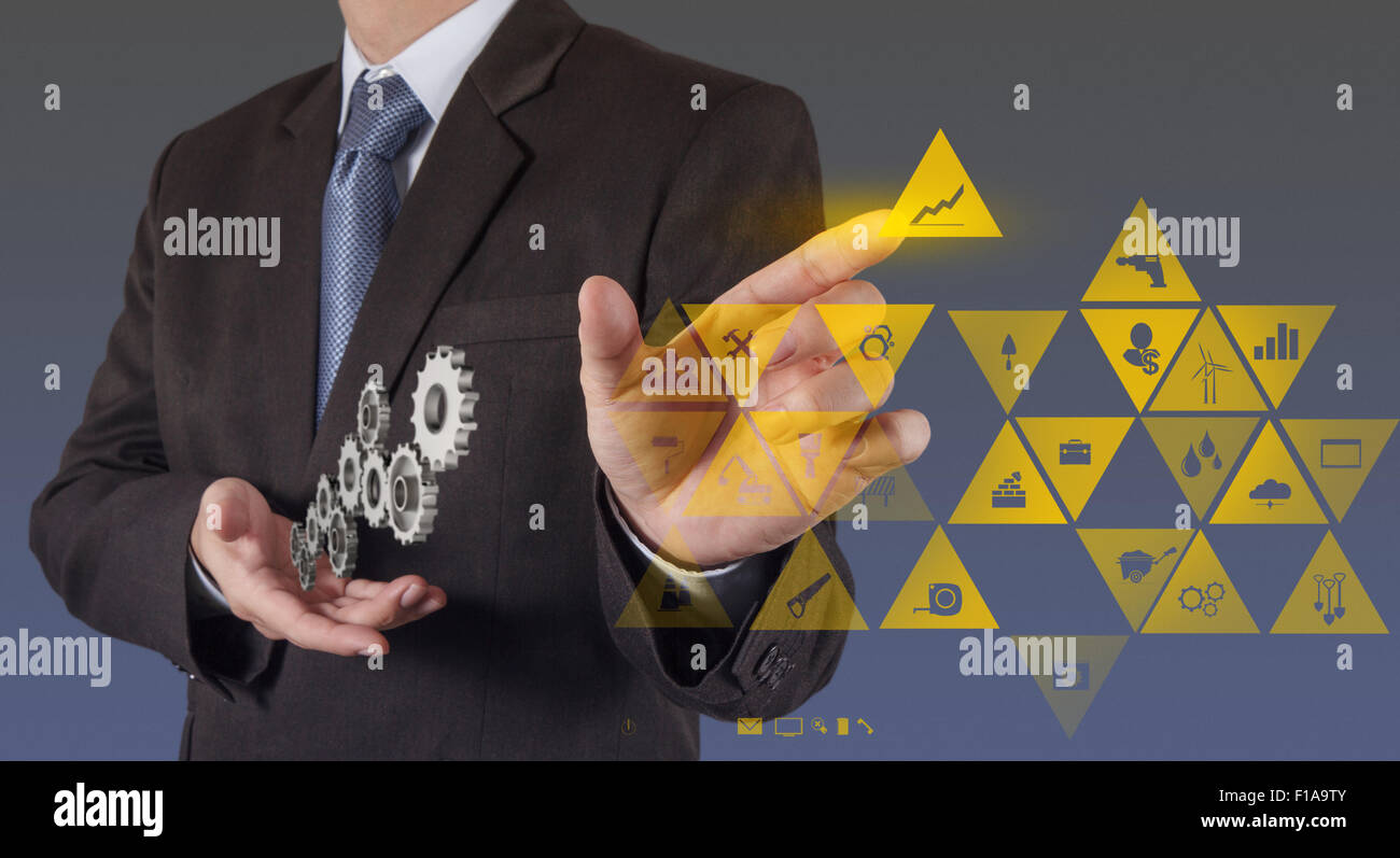 businessman hand working with new computer interface show building ...