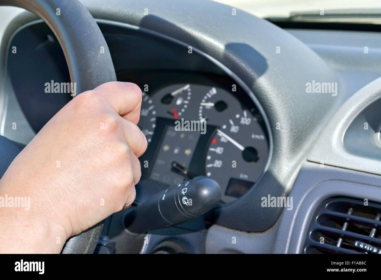 Closeup of a hand and the steering wheel while driving the car Stock ...