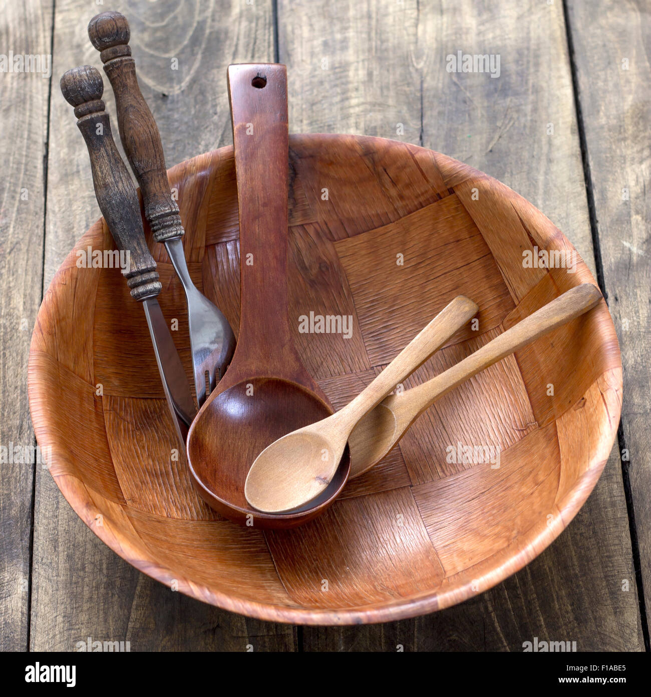 Wood kitchen utensils over wooden table background, close up Stock ...