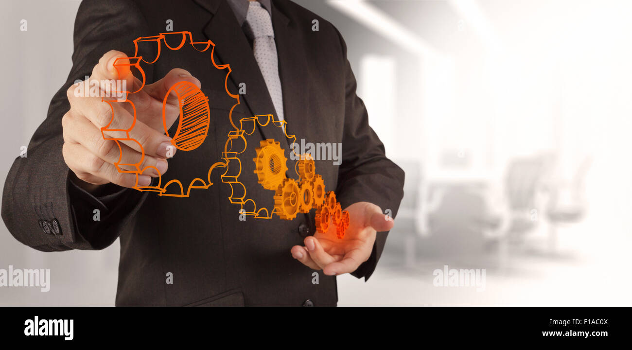 businessman hand draws gear to success concept Stock Photo - Alamy
