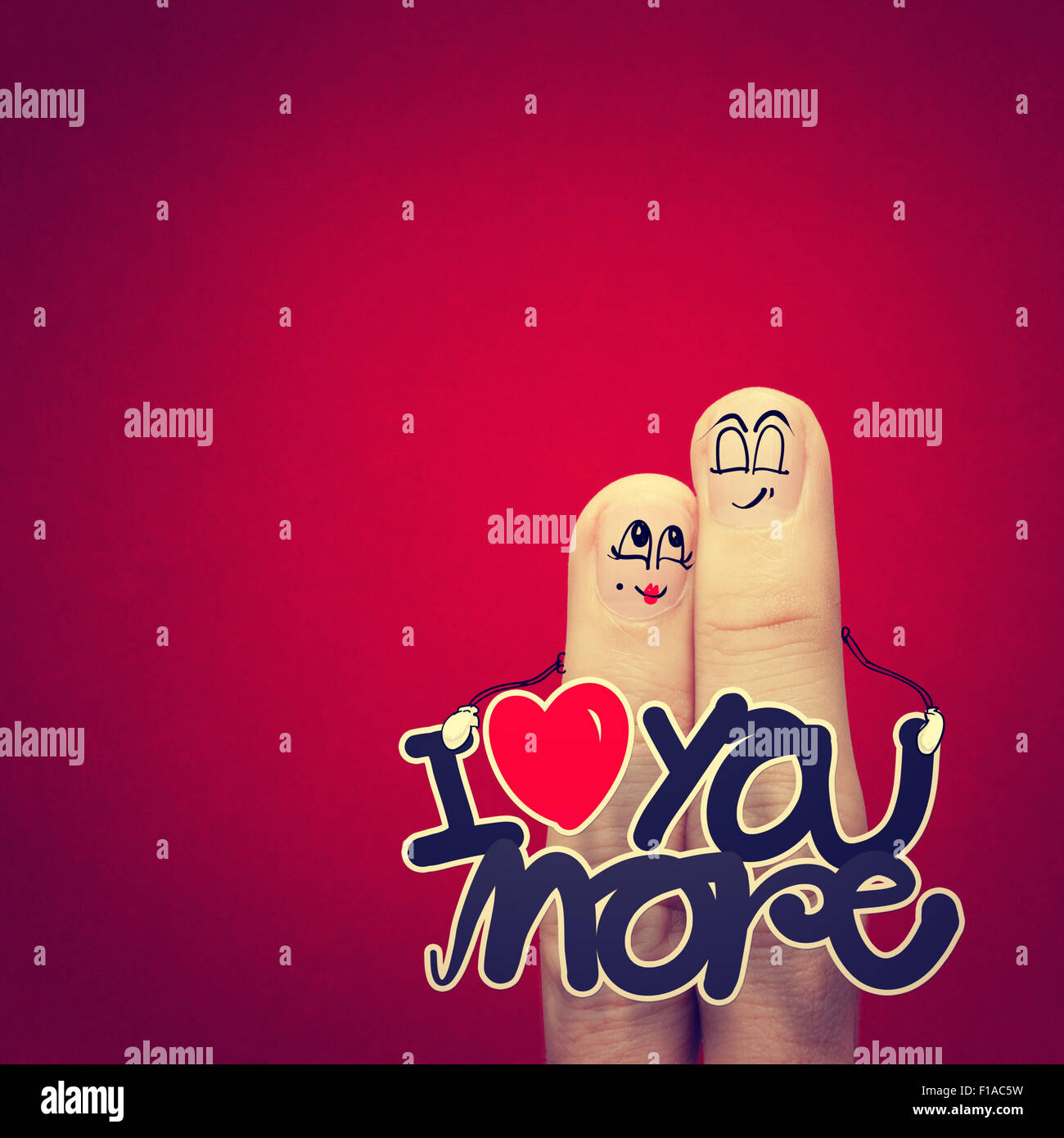 the happy vintage finger couple in love with painted smiley and hold ...