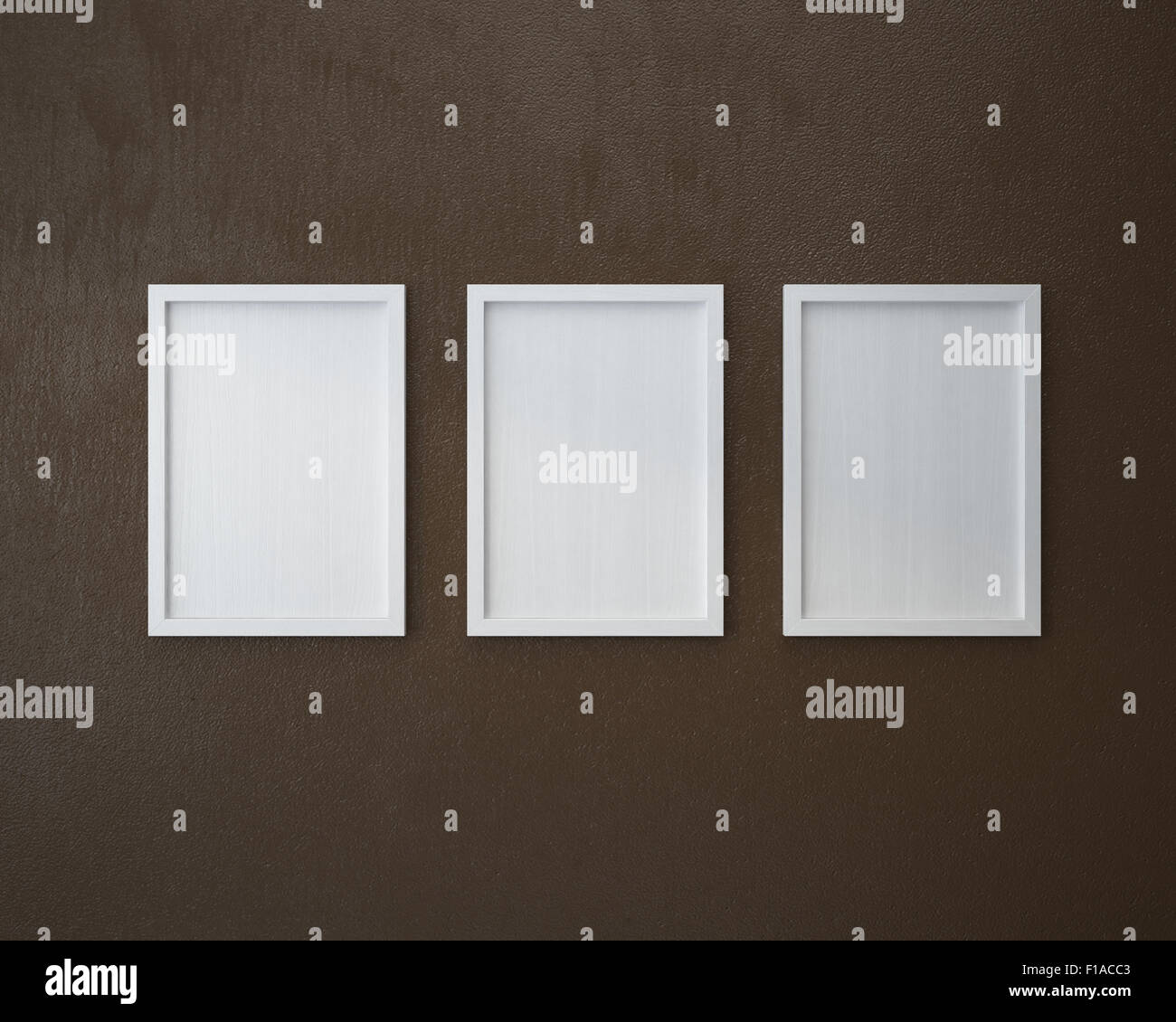 3 Blank frame on brown wall Stock Photo - Alamy