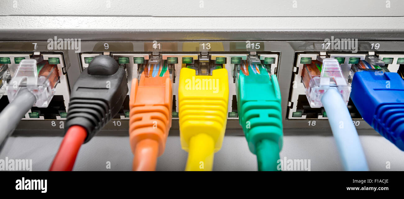 Network Ethernet switch with connected cables Stock Photo - Alamy