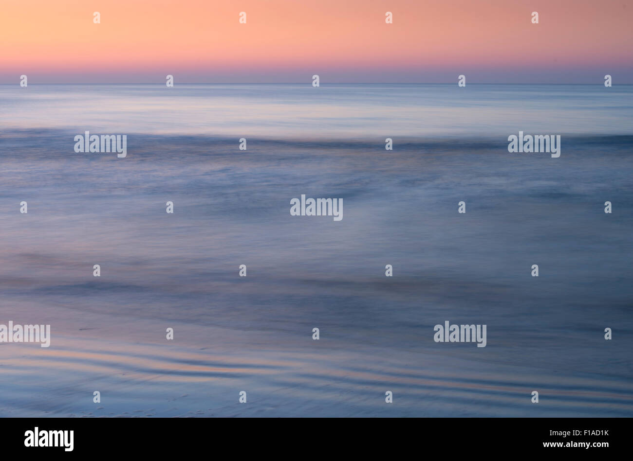 Ocean In Motion At Sunrise Stock Photo - Alamy