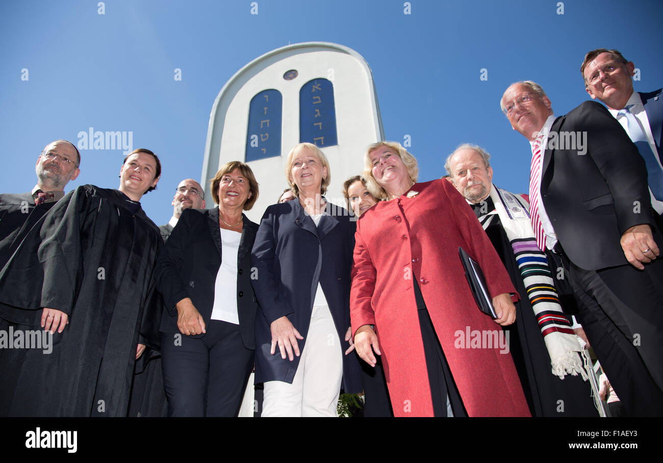 (From left to right) Rabbi Eli Reich, Rabbi Natalia Verzhbovska, cantor ...